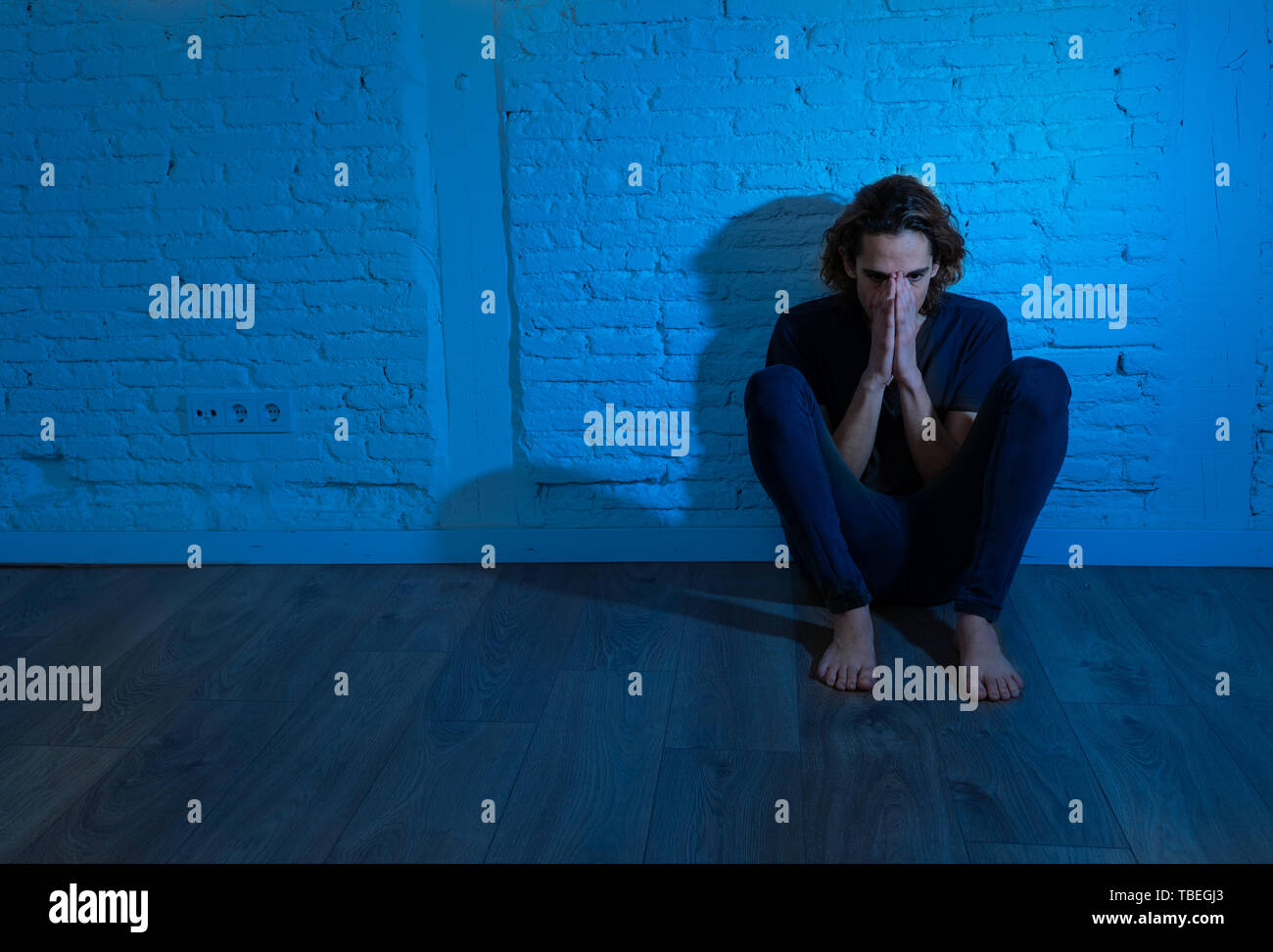 Devastated depressed millennial man crying sad feeling hurt suffering ...