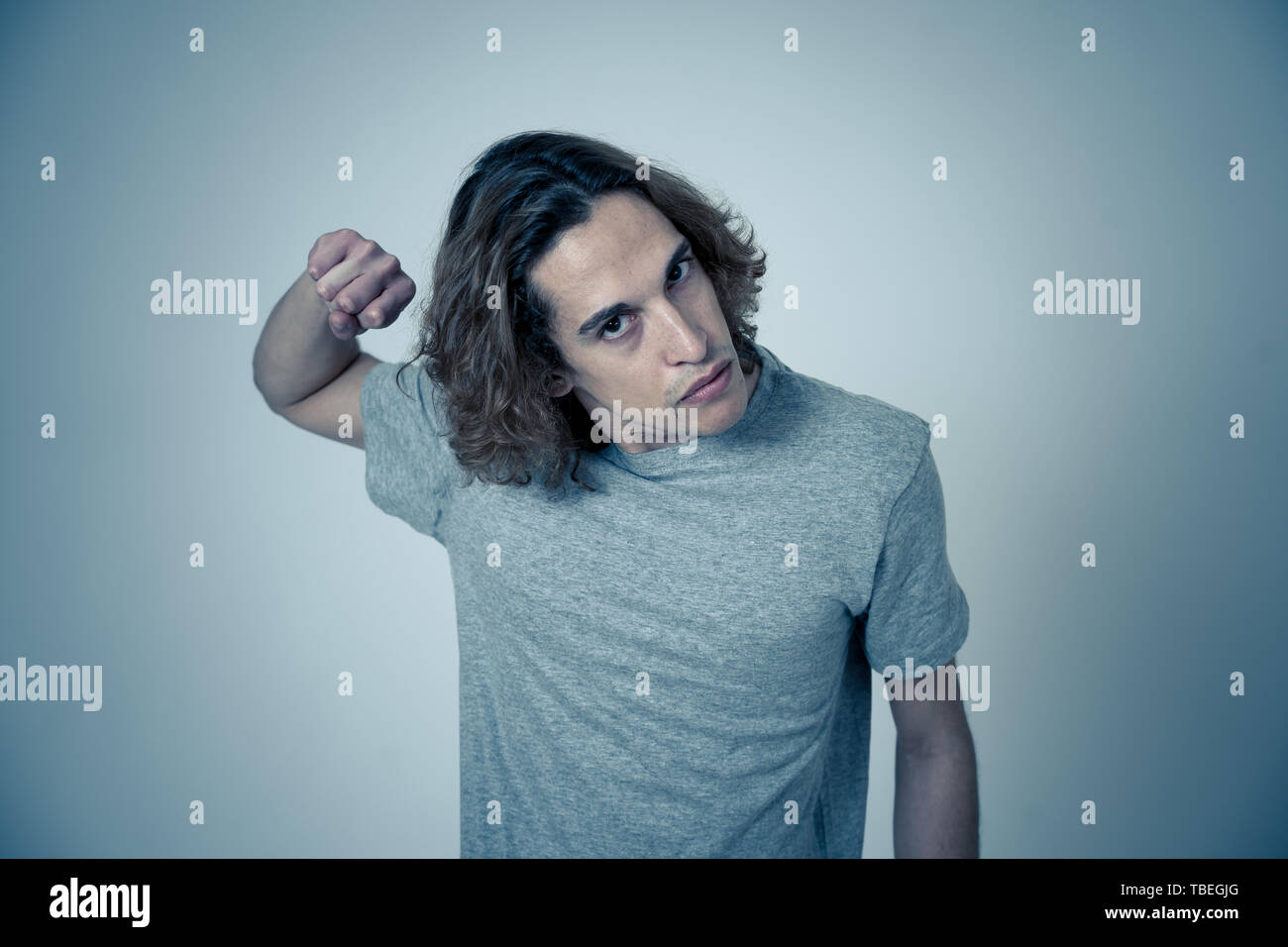 Portrait of young teen male with angry face looking displeased and ...