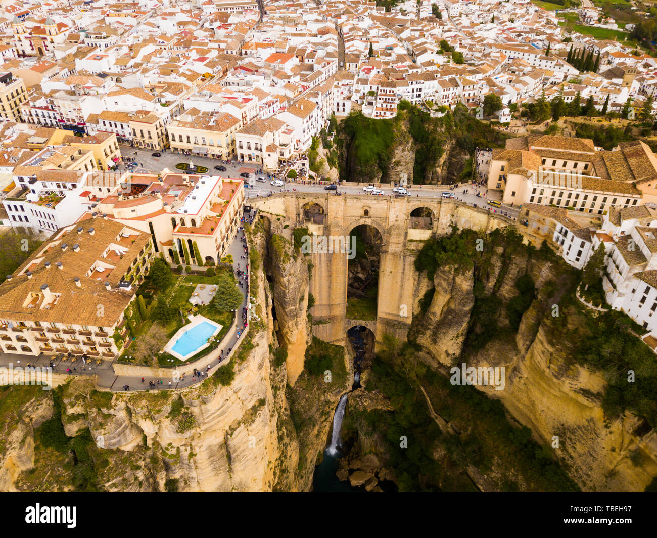 Aerial view of rocky landscape of Ronda with buildings and Bridge ...