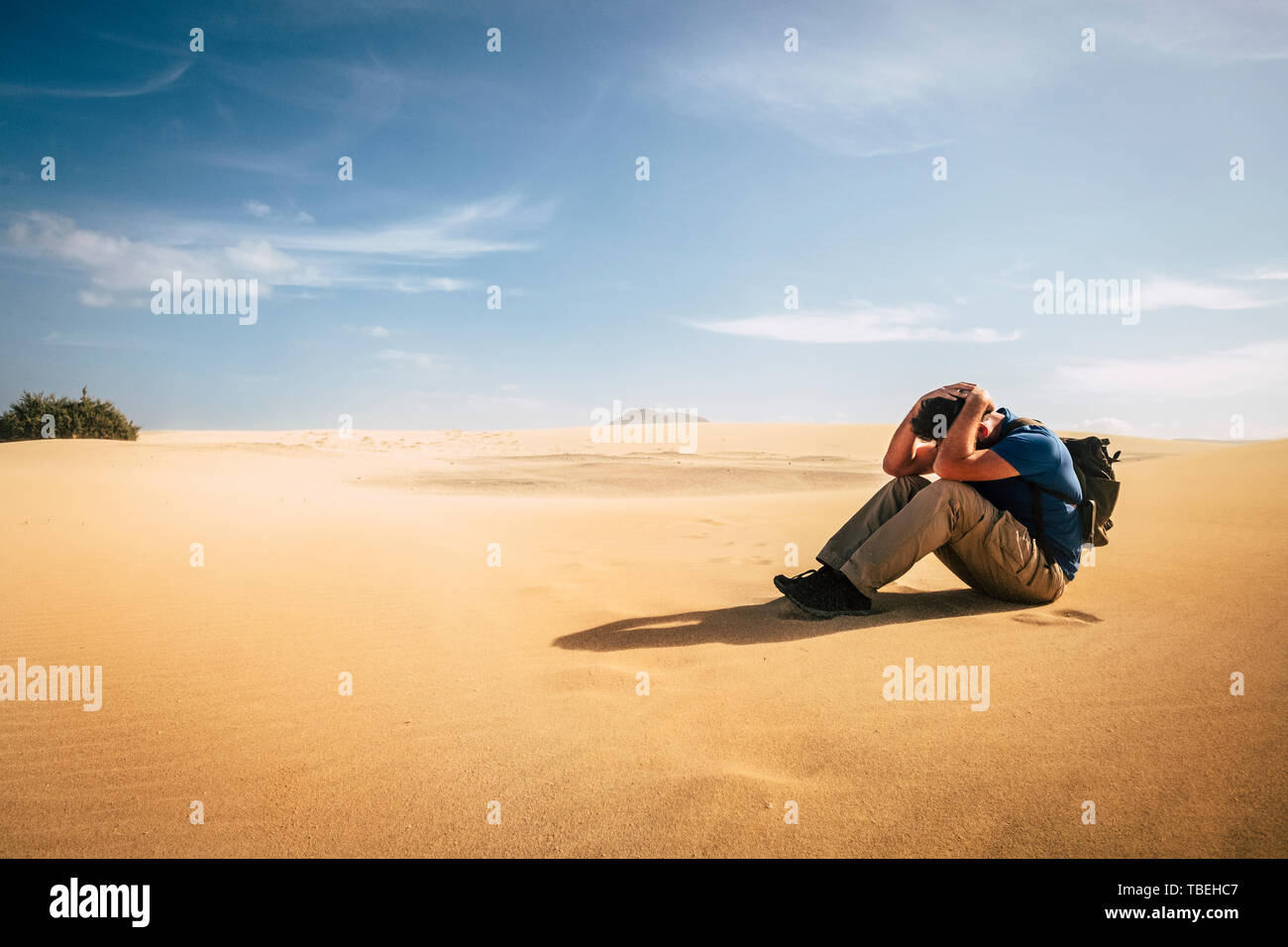 Man Sitting Alone In Desert