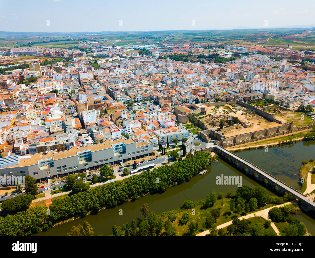Aerial panoramic view of modern Merida cityscape on banks of Guadiana ...