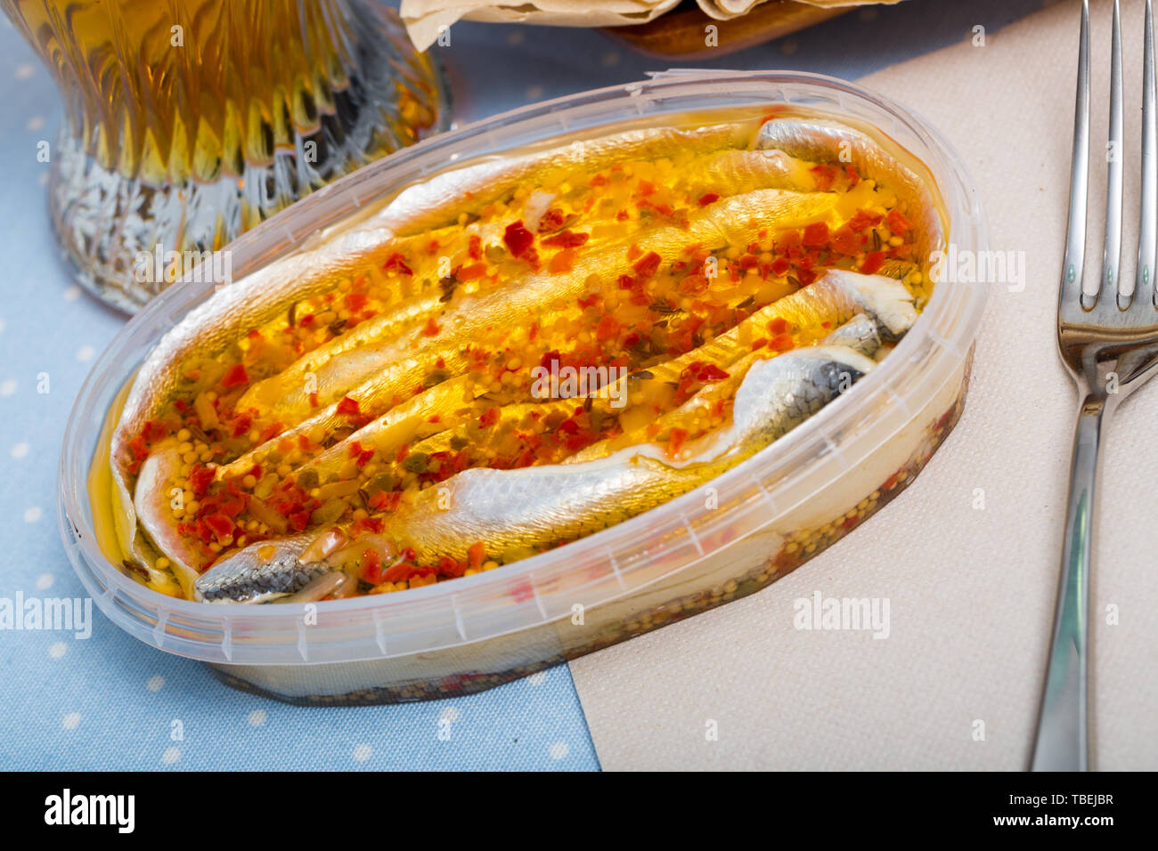 Marinated herring fillet in a plastic jar Stock Photo - Alamy
