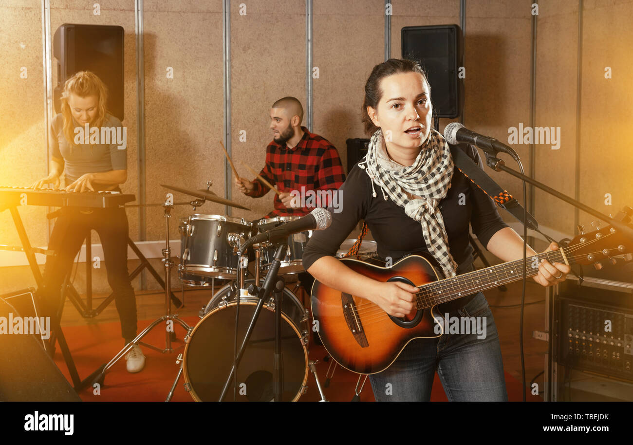 Music garage band with passionate emotional woman vocalist and ...