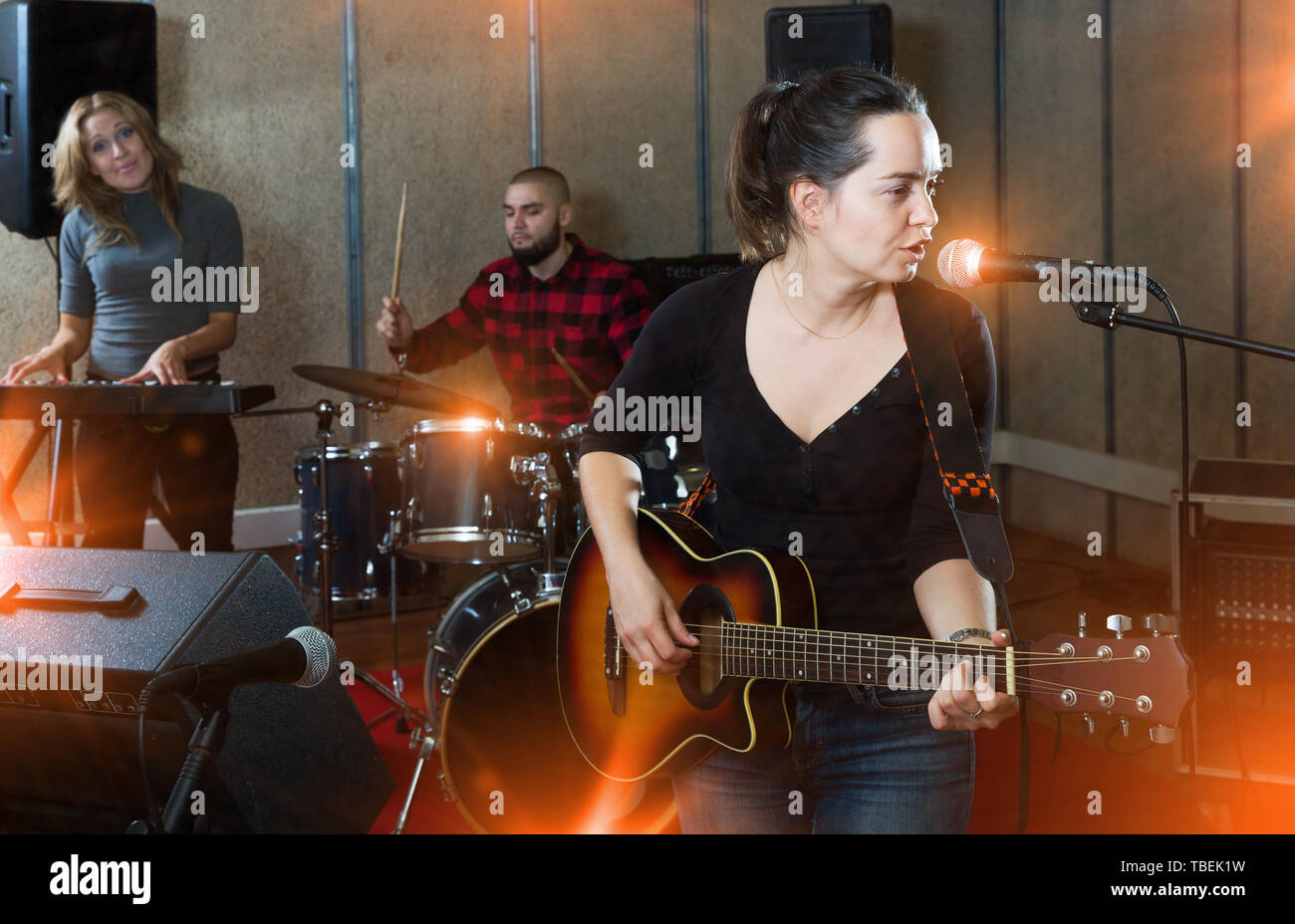 Group of young musicians with passionate emotional female vocalist and ...