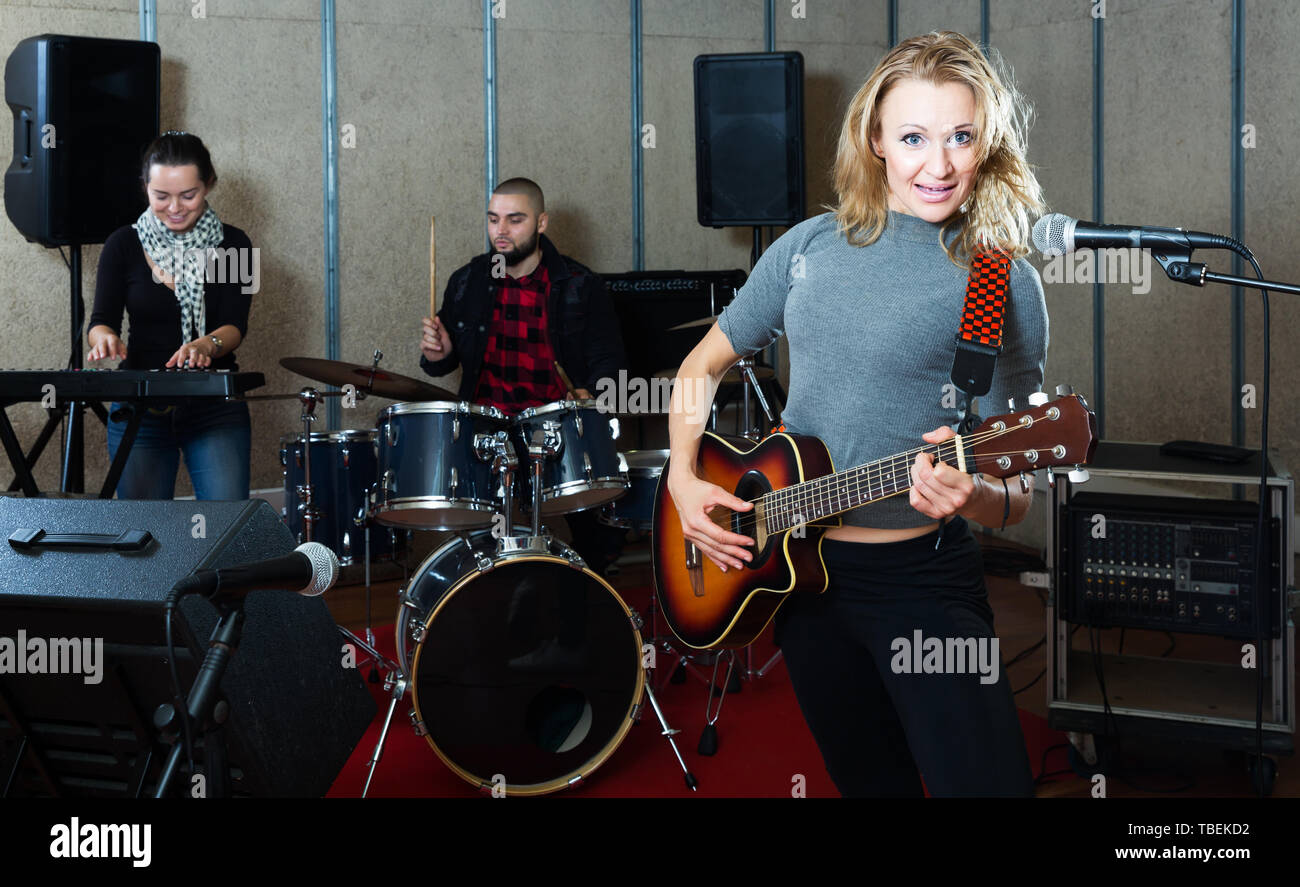 Music garage band with passionate emotional woman vocalist and ...