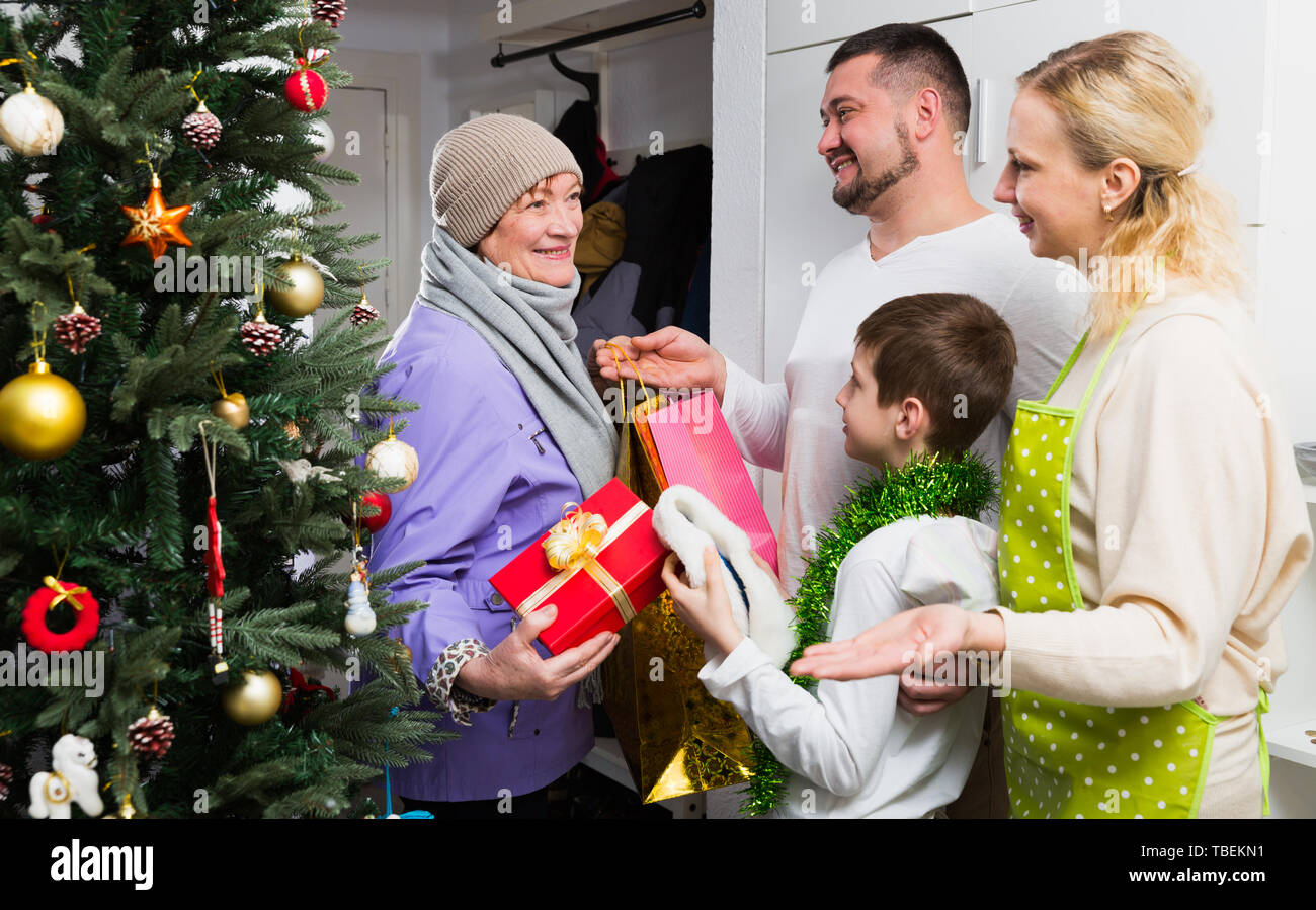Happy senior woman visiting family of her son for celebration of New ...
