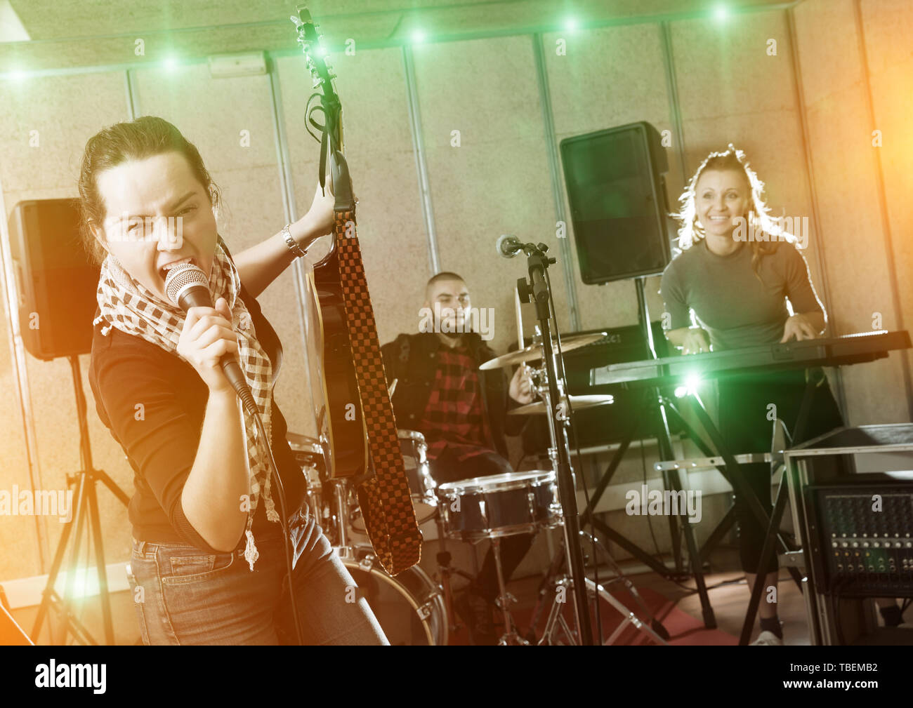 Music garage band with passionate emotional woman vocalist and ...