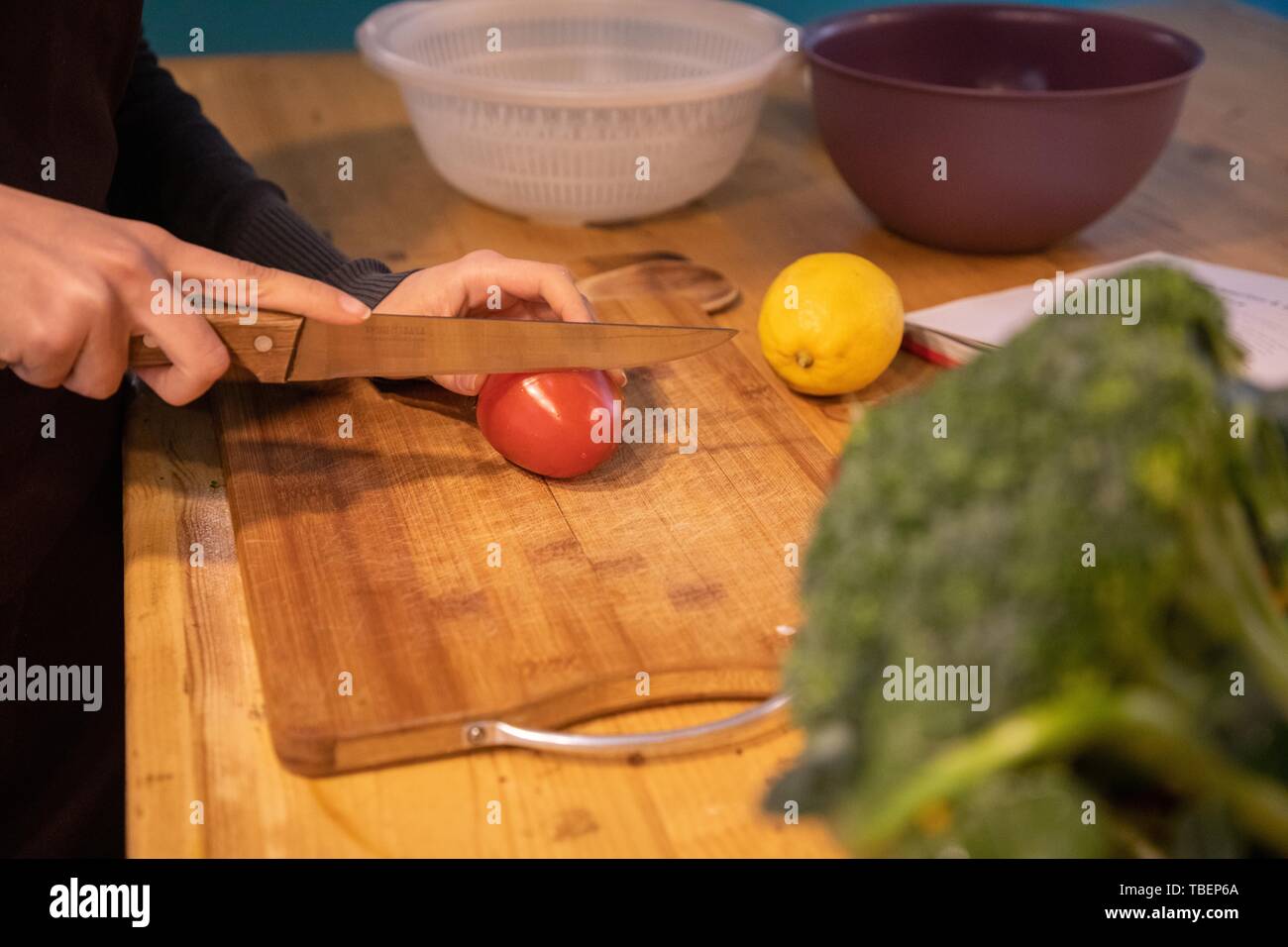Female's hand cutting vegetables in the kitchen Stock Photo - Alamy