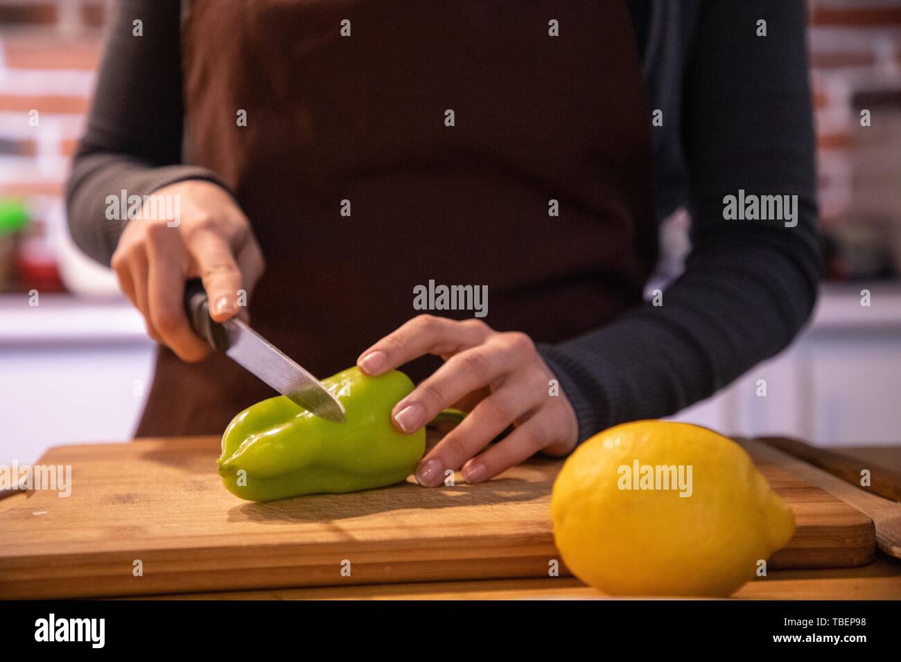 Female's hand cutting vegetables in the kitchen Stock Photo - Alamy