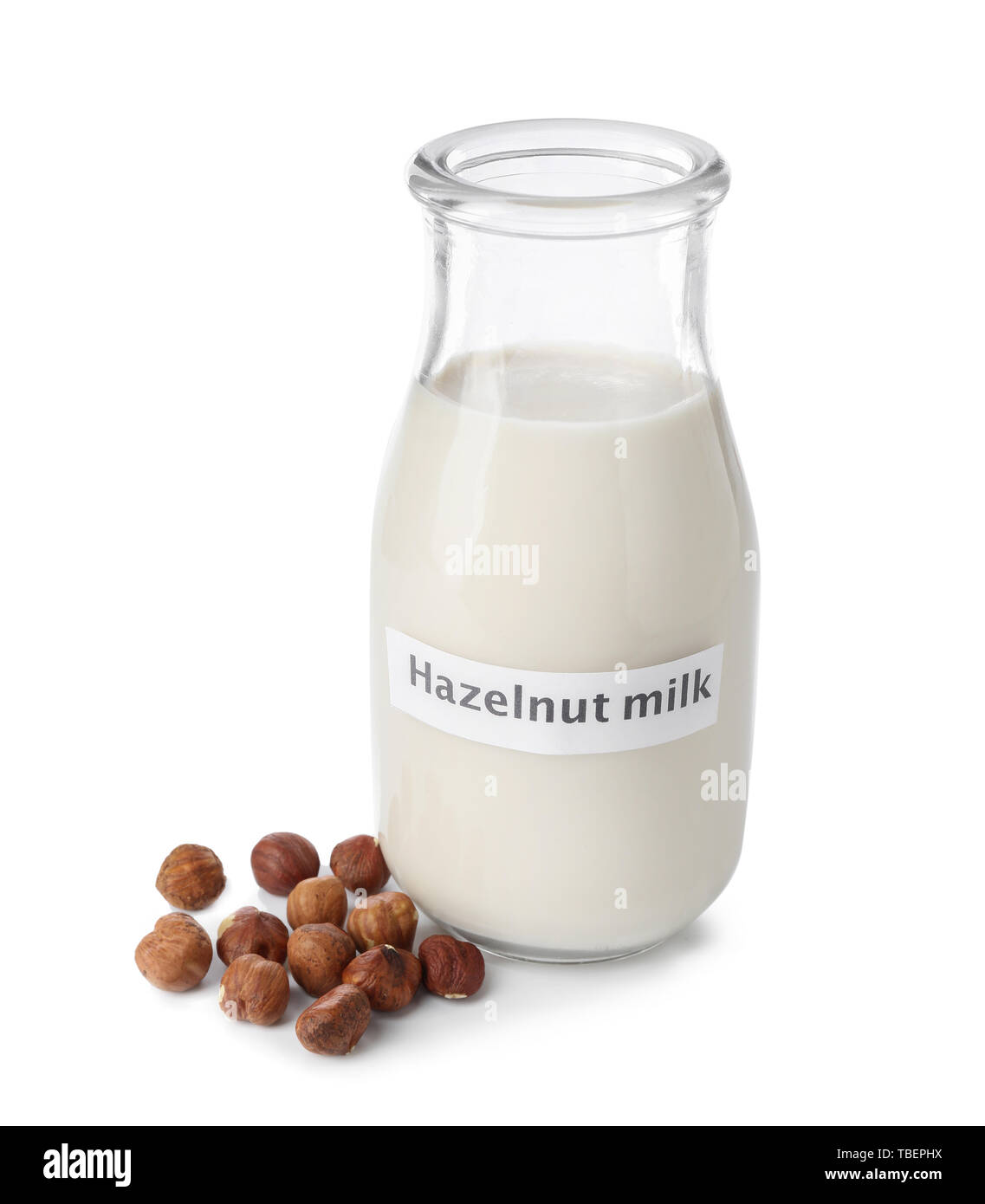 Bottle of healthy hazelnut milk on white background Stock Photo - Alamy