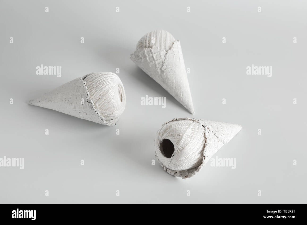 Wafer cones with clews on white background Stock Photo - Alamy