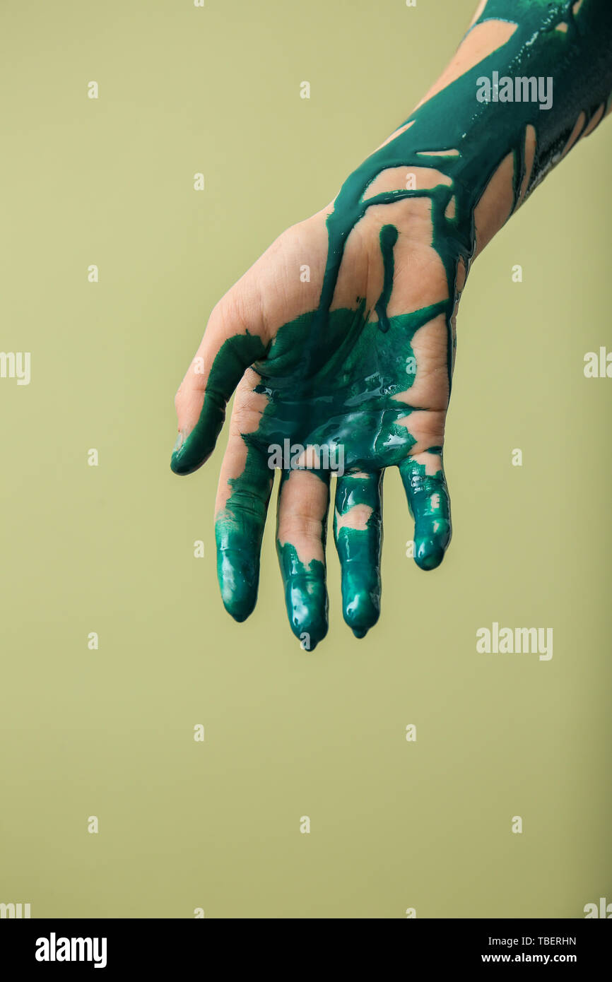 Painted hand on color background Stock Photo - Alamy