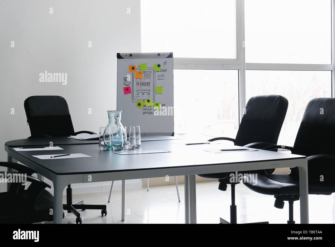 Table prepared for business meeting in conference hall Stock Photo - Alamy