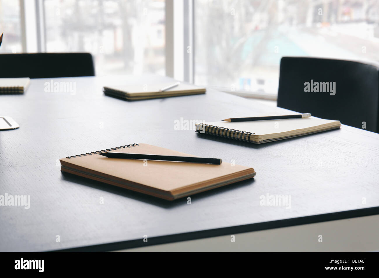 Table with stationery prepared for business meeting in conference hall ...