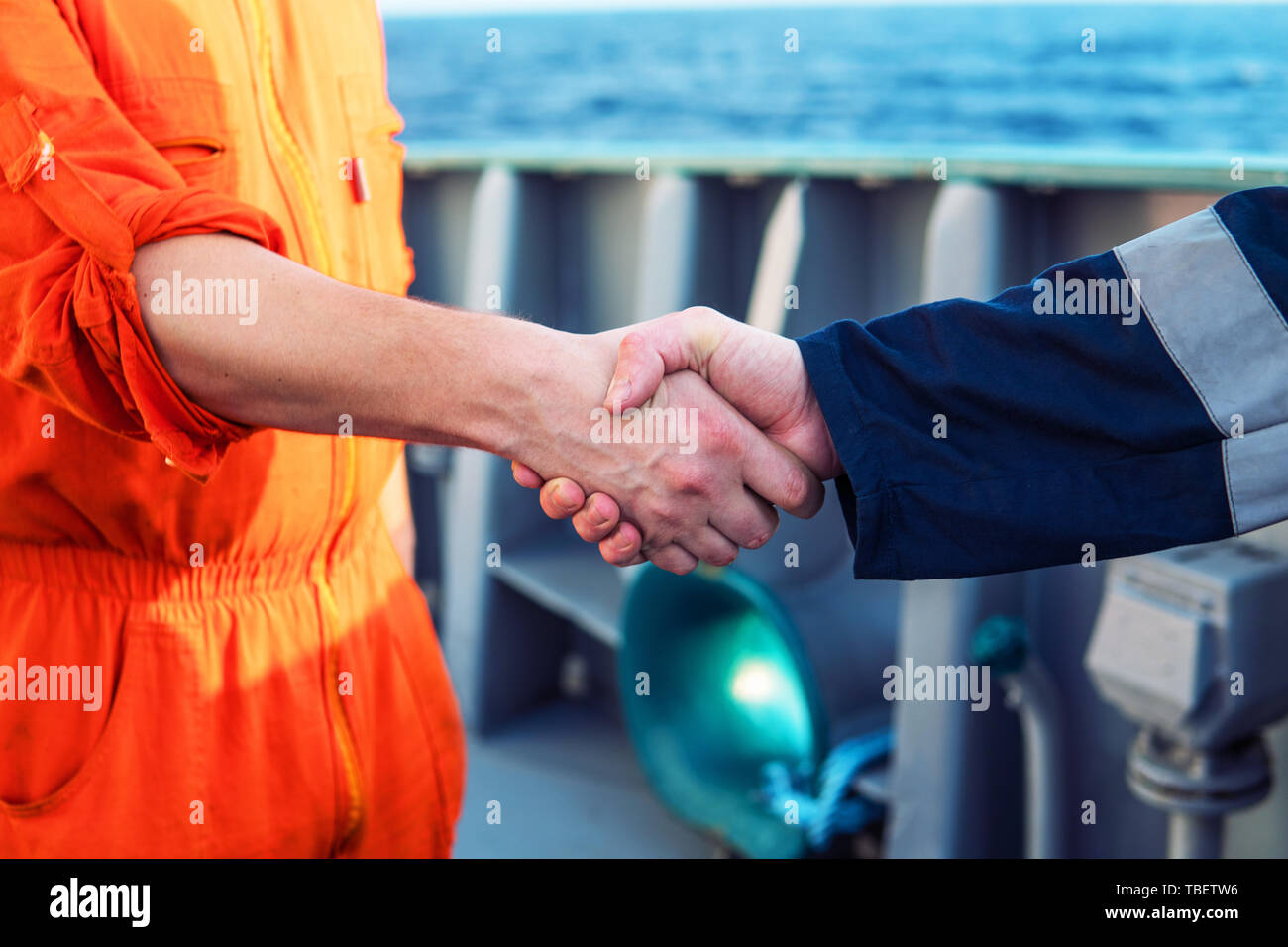 marine contractor businessman handshaking with worker on the ship Stock ...