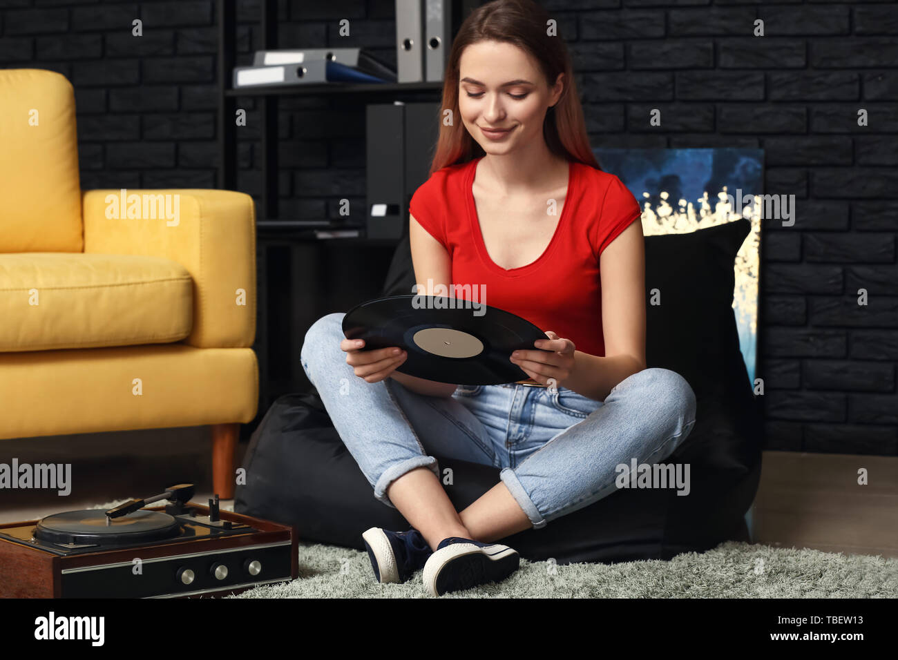 Young woman with old record player and vinyl disc at home Stock Photo ...