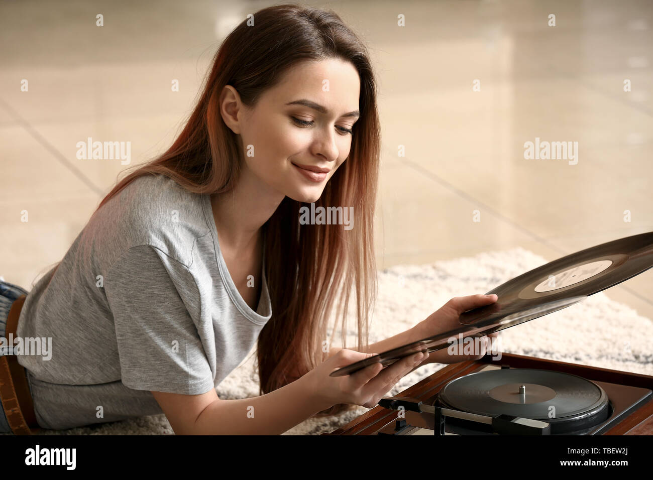 Young woman with old record player and vinyl discs at home Stock Photo ...
