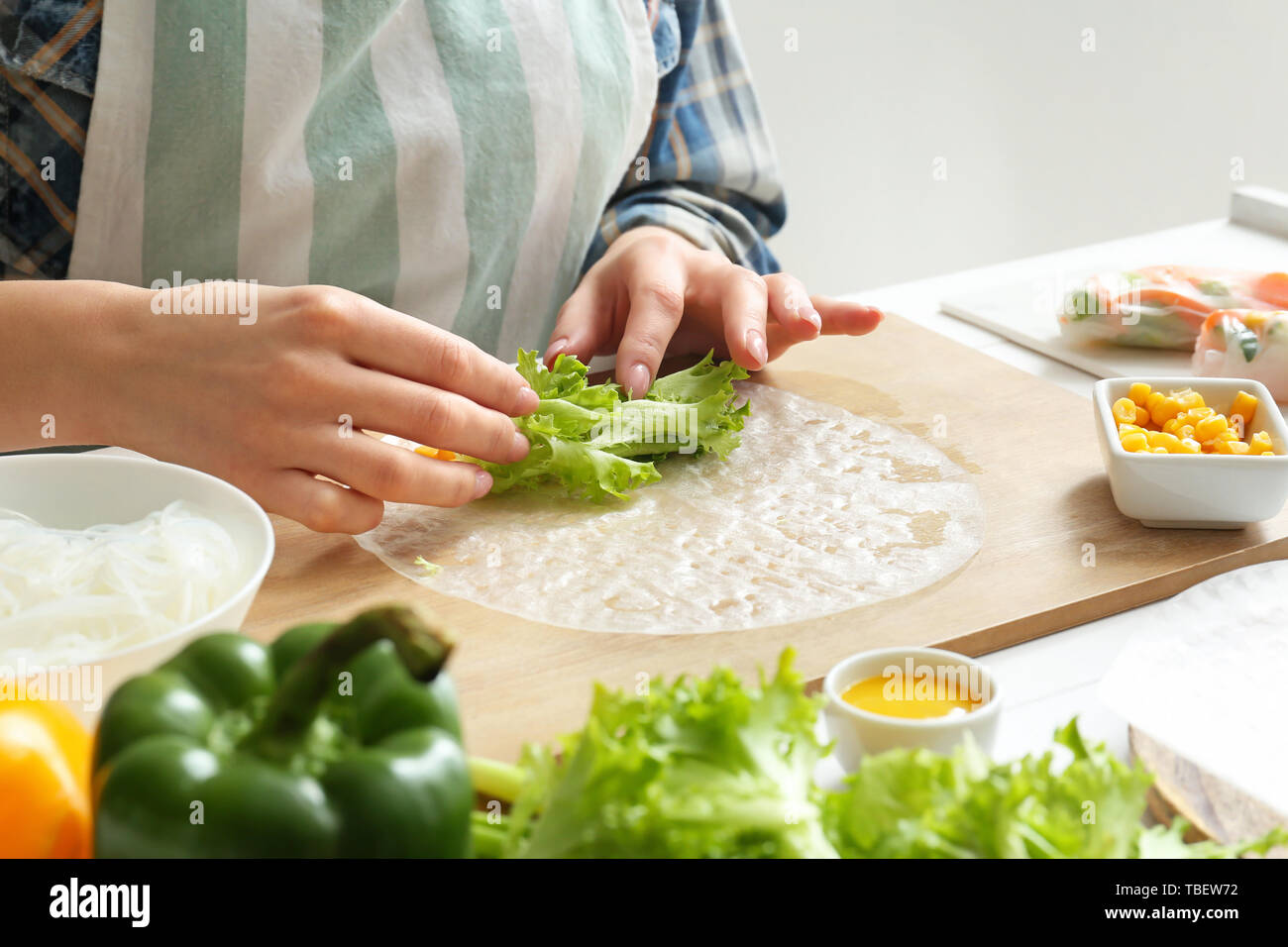 Woman eating vietnamese spring rolls hi-res stock photography and ...