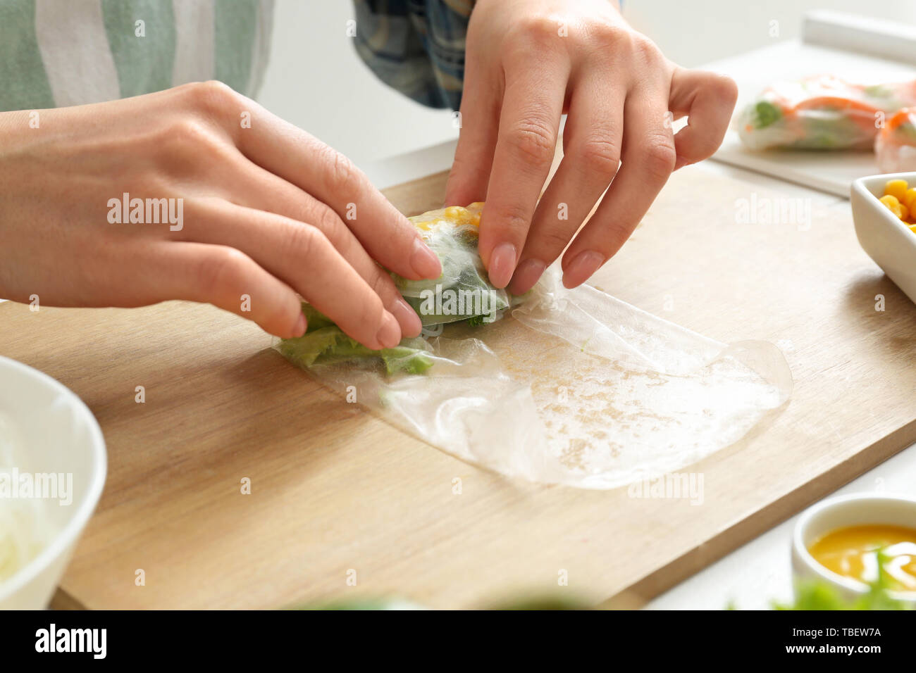 Woman eating vietnamese spring rolls hi-res stock photography and ...