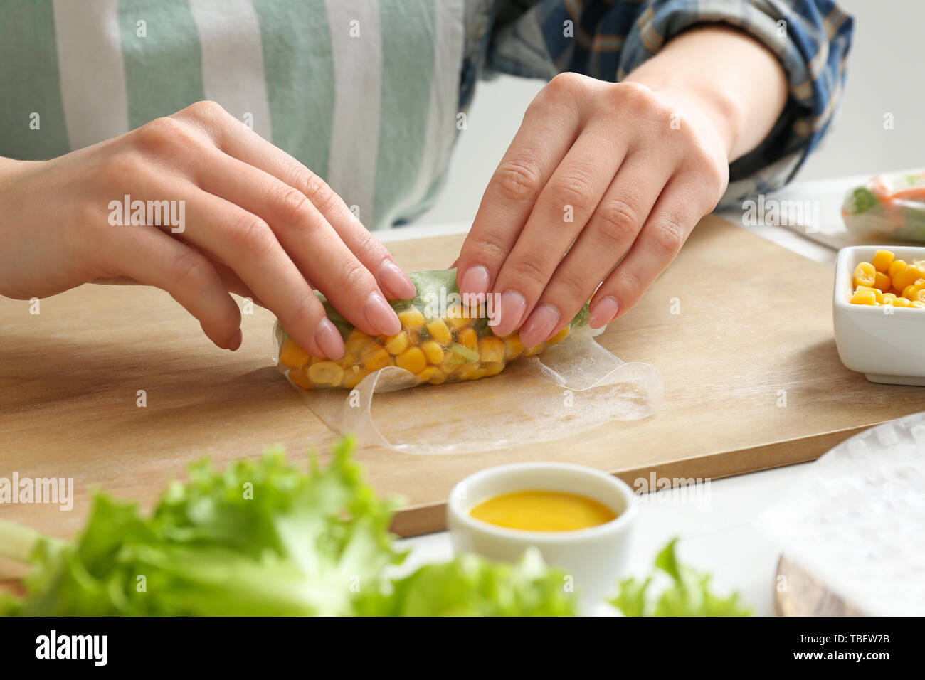 Woman eating vietnamese spring rolls hi-res stock photography and ...
