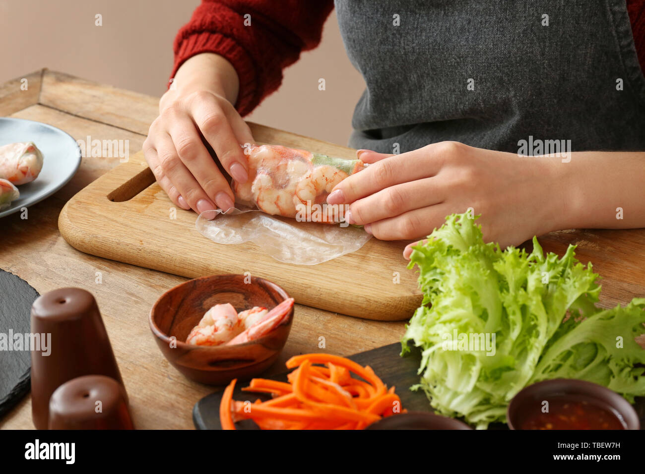Woman eating vietnamese spring rolls hi-res stock photography and ...