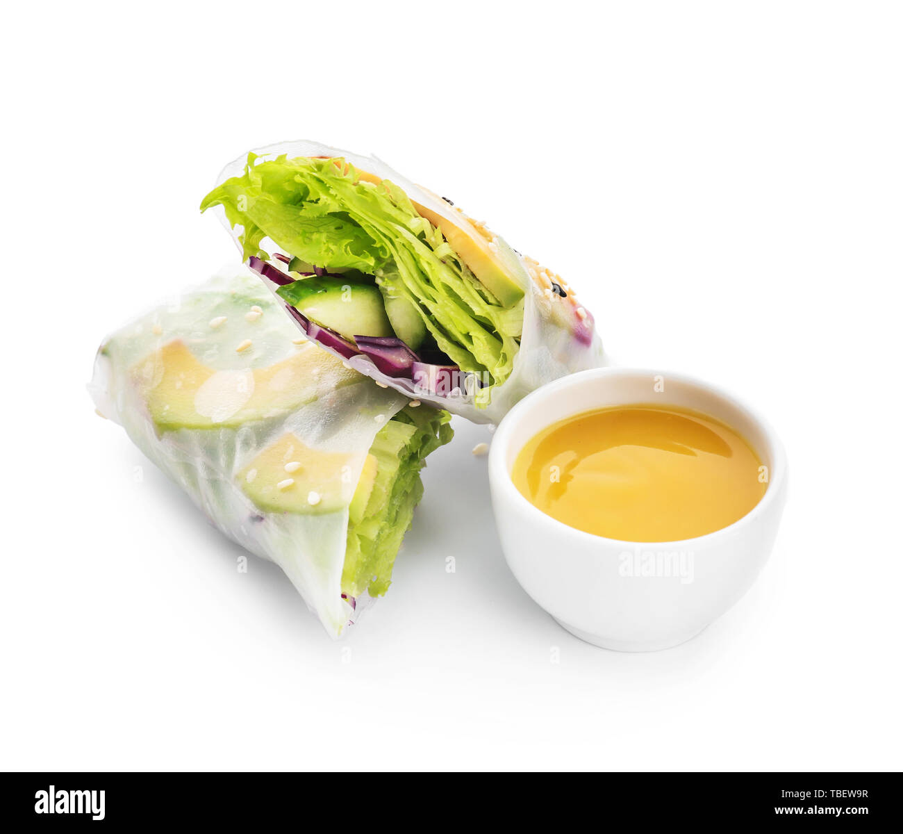 Tasty spring rolls with sauce on white background Stock Photo - Alamy