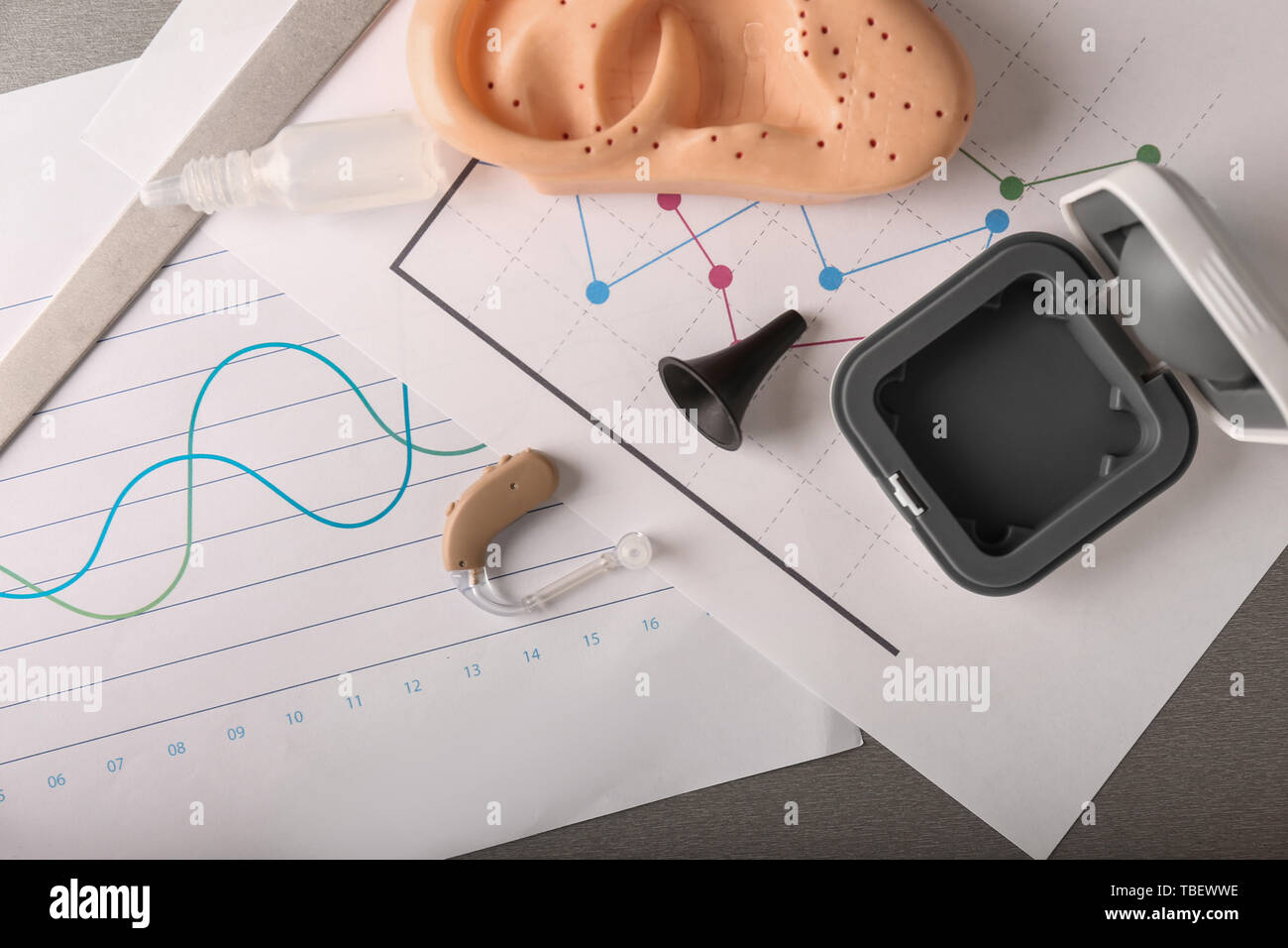Box with hearing aid and model of ear on table of doctor Stock Photo ...