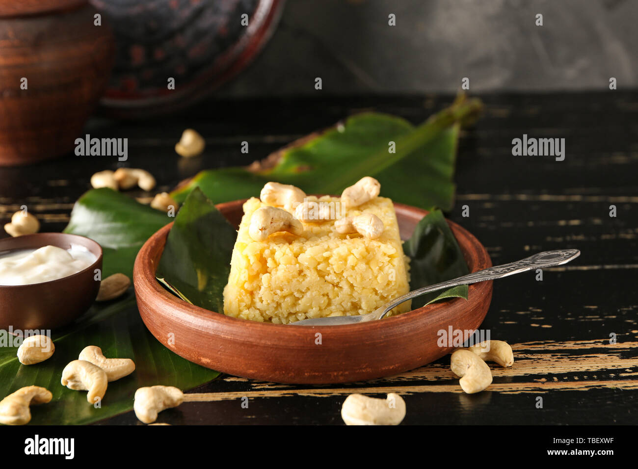 Plate with traditional Indian food pongal on table Stock Photo - Alamy