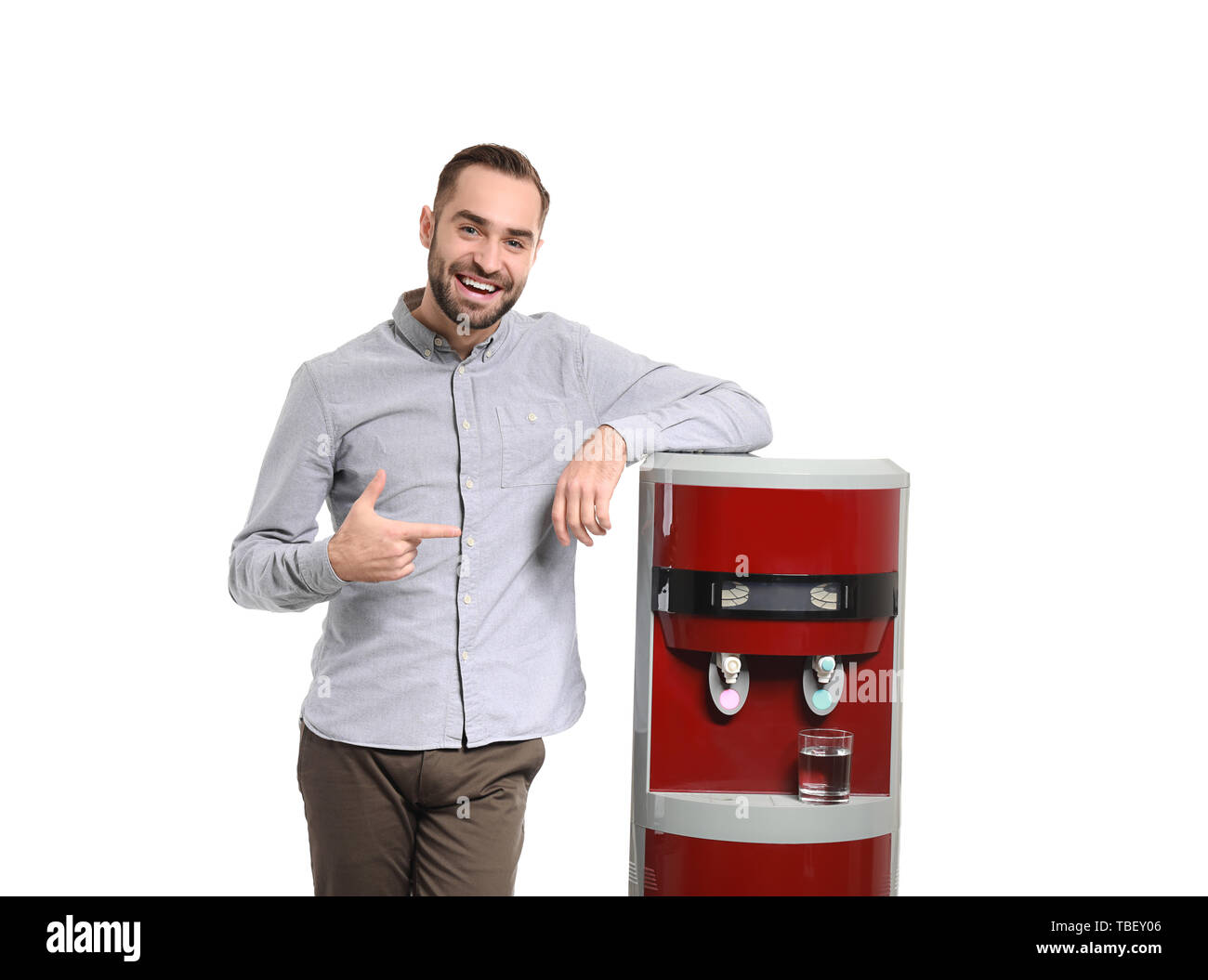 Man near water cooler on white background Stock Photo - Alamy