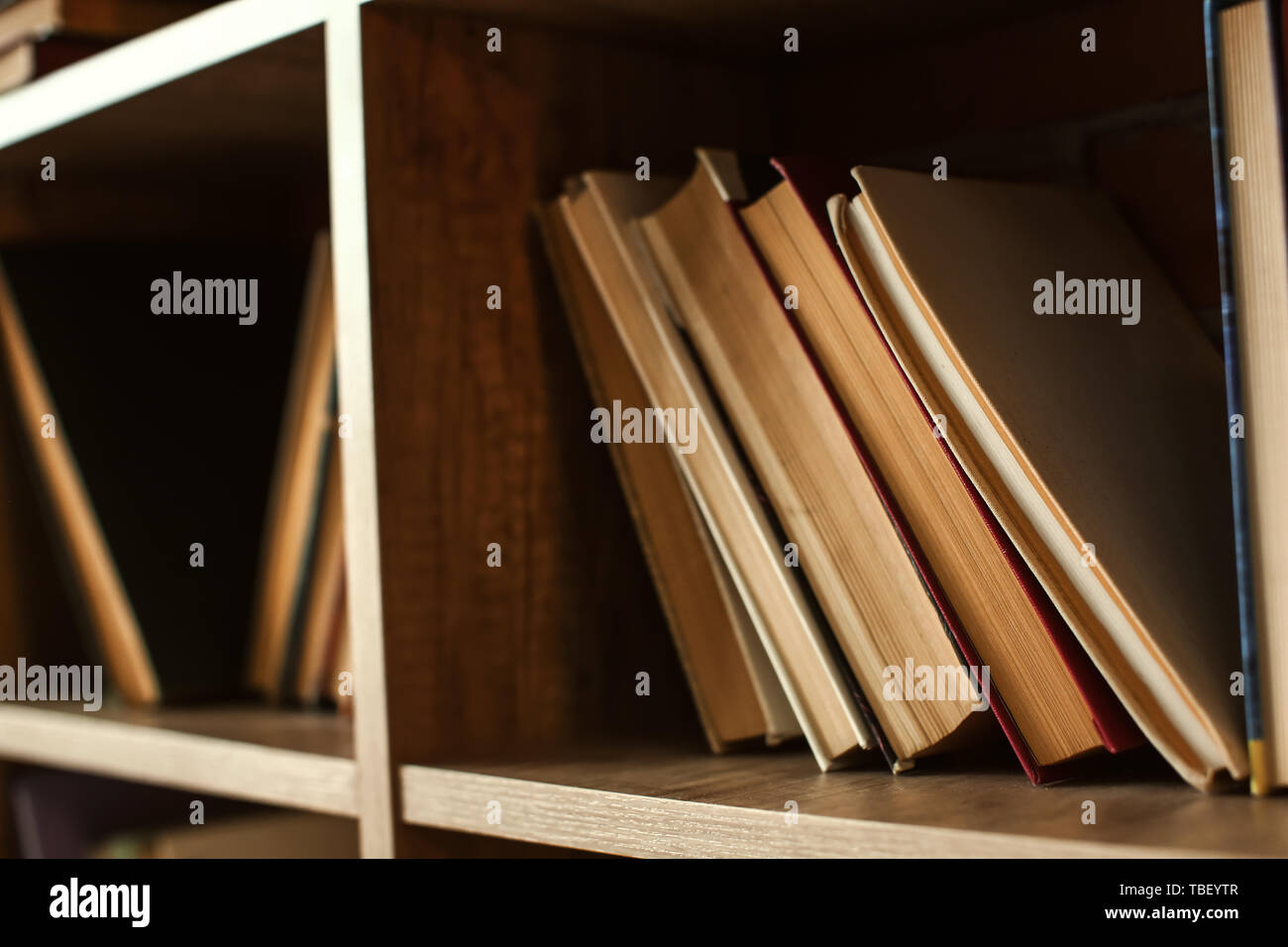 Books on shelf in library Stock Photo - Alamy