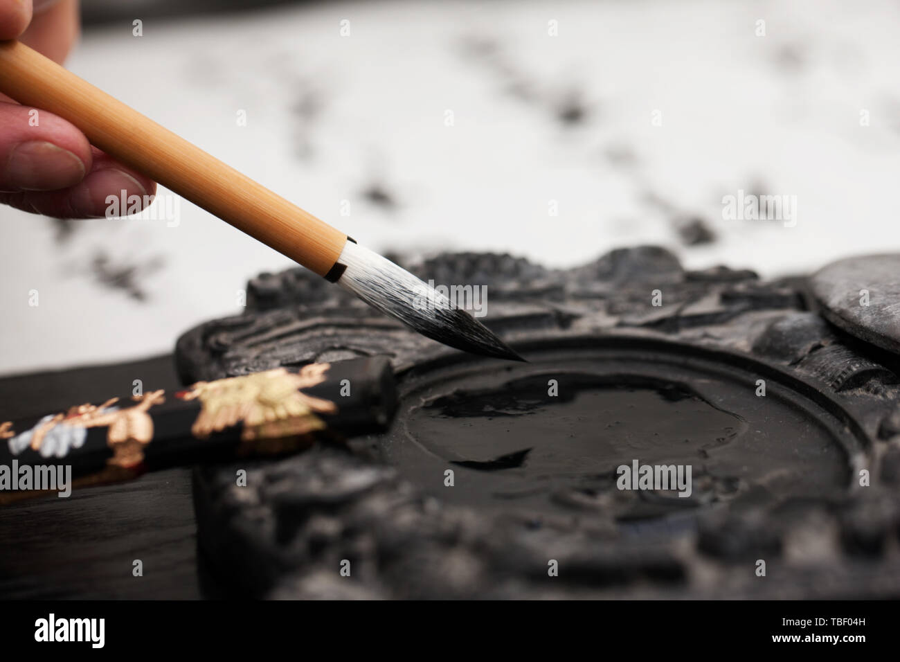 An old man practicing calligraphy Stock Photo - Alamy