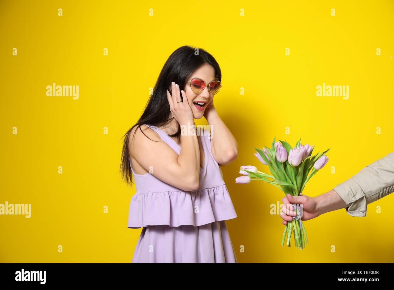 Surprised woman receiving flowers hi-res stock photography and images ...