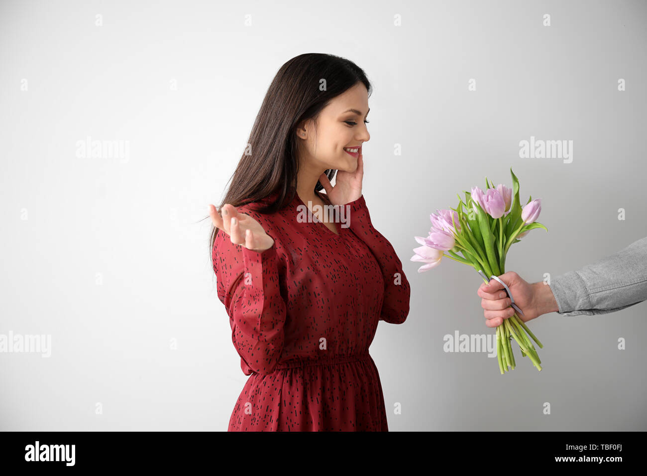 Woman receiving flowers surprised hi-res stock photography and images ...