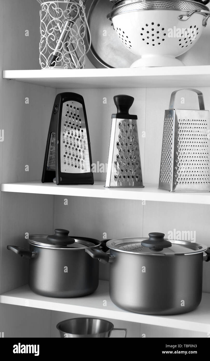 Set of kitchen utensils on shelves Stock Photo - Alamy
