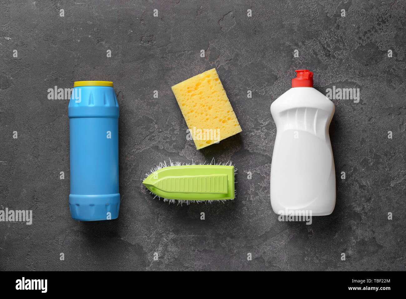 Set of cleaning supplies on grey background Stock Photo - Alamy