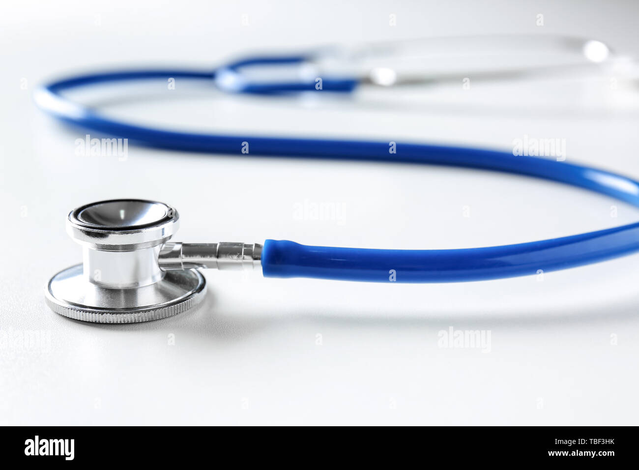 Medical stethoscope on white table Stock Photo - Alamy