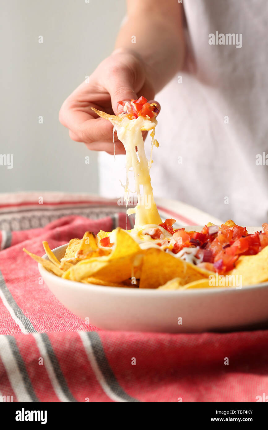 Eating nachos people hi-res stock photography and images - Alamy