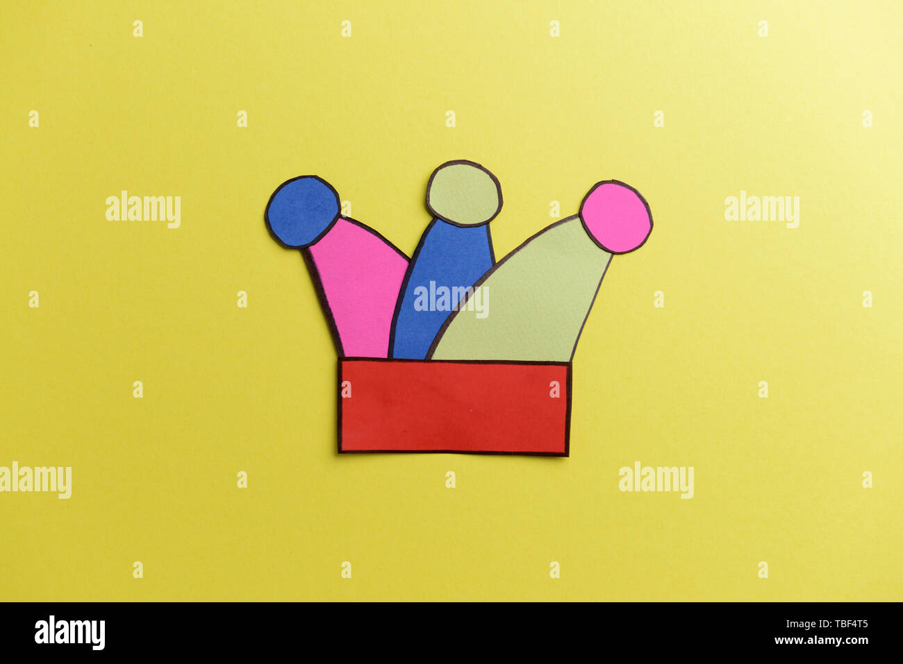 Paper crown on color background. April Fool's Day prank Stock Photo - Alamy