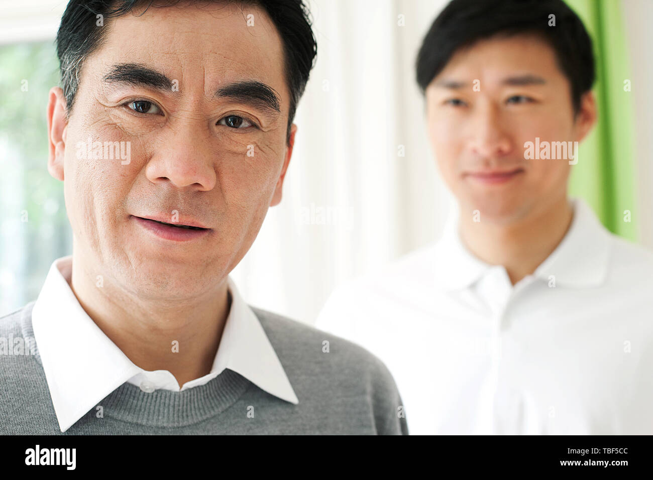 A portrait of a father and son Stock Photo - Alamy