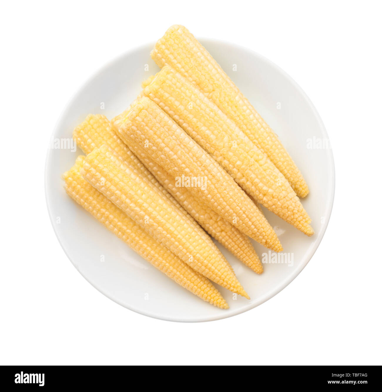 Plate with baby corn cobs on white background Stock Photo - Alamy