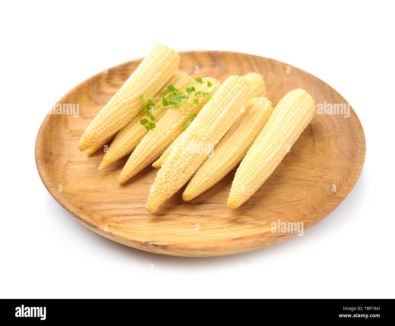 Plate with baby corn cobs on white background Stock Photo - Alamy