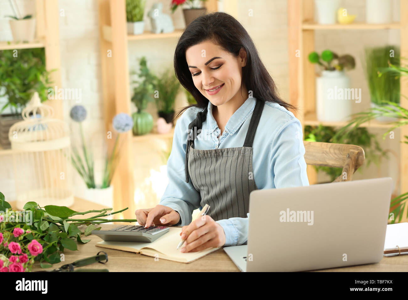 Beautiful female florist working hi-res stock photography and images ...