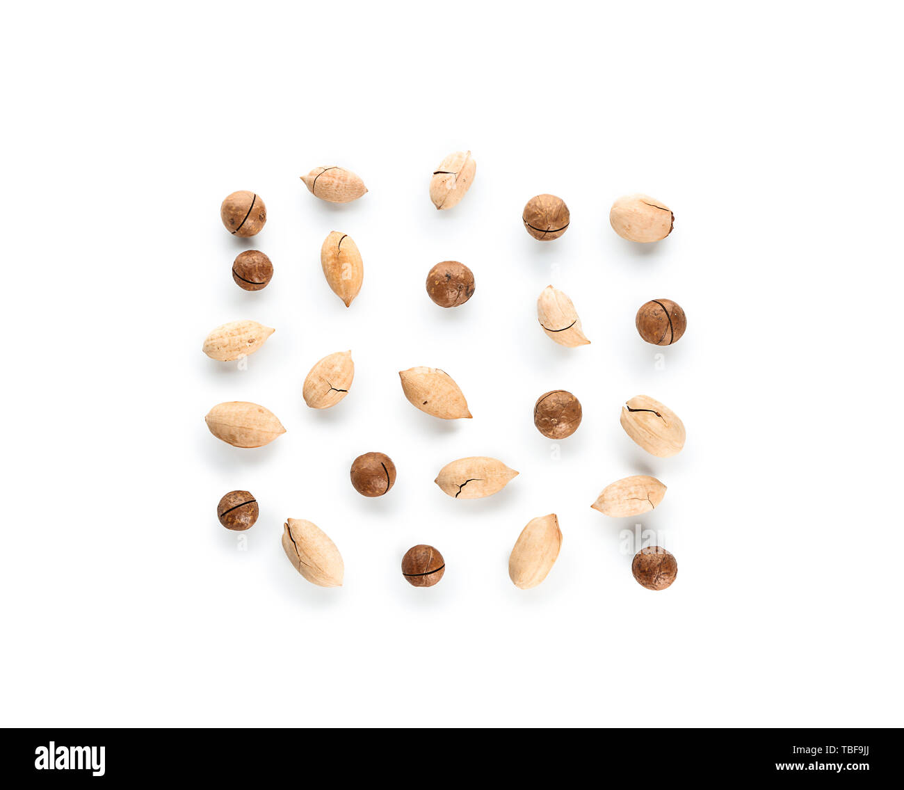 Different tasty nuts on white background Stock Photo - Alamy