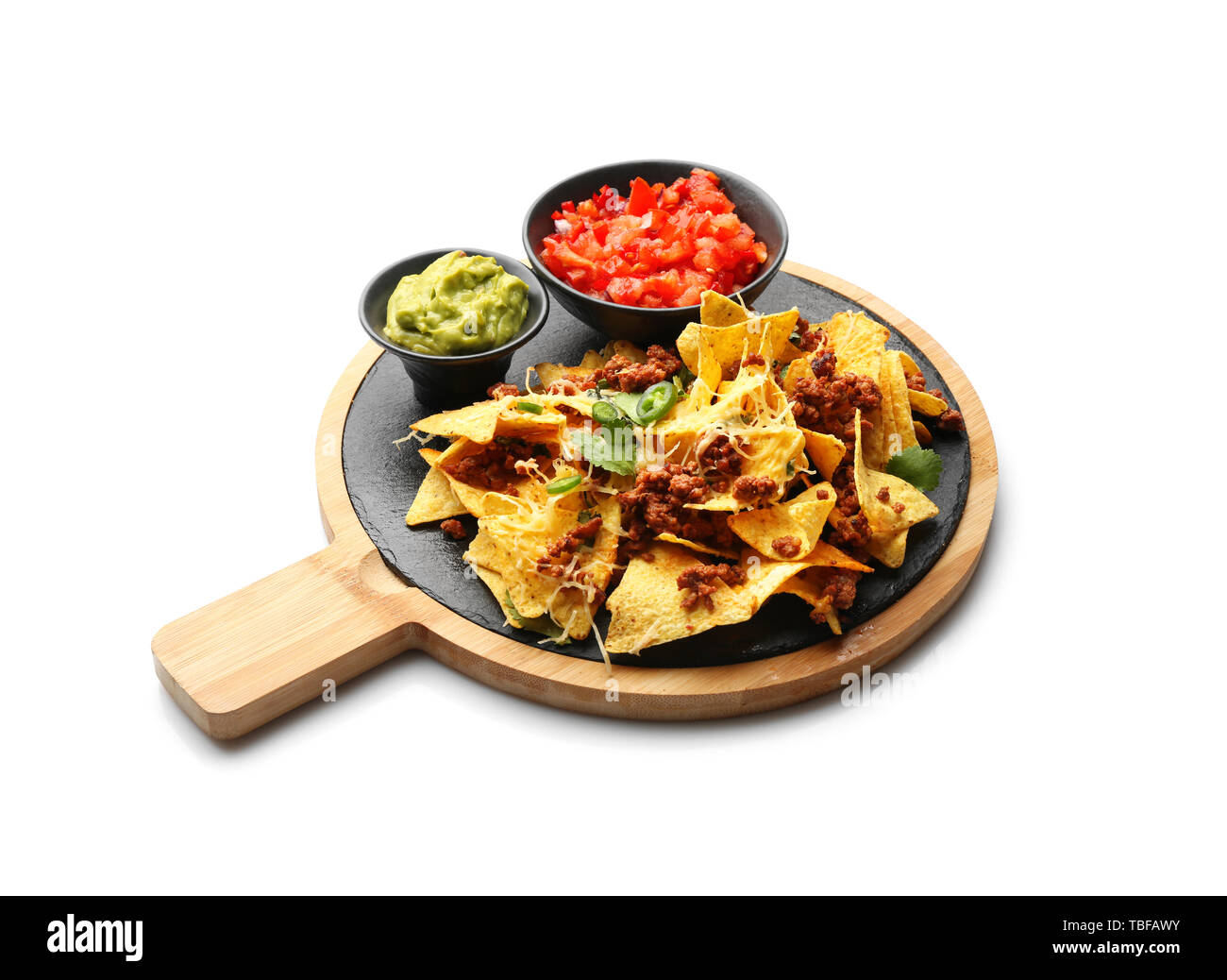 Board with tasty nachos, meat and sauces on white background Stock ...