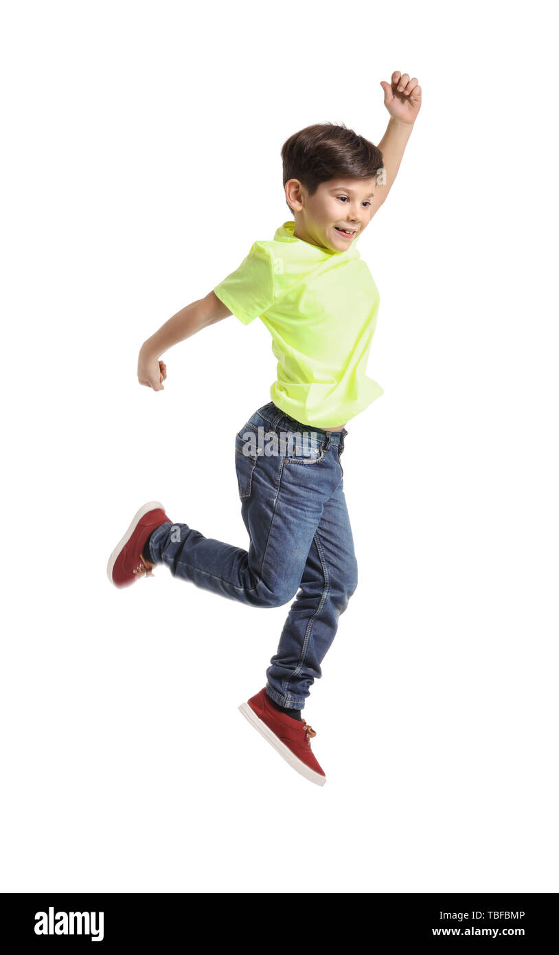 Cute little boy jumping against white background Stock Photo - Alamy