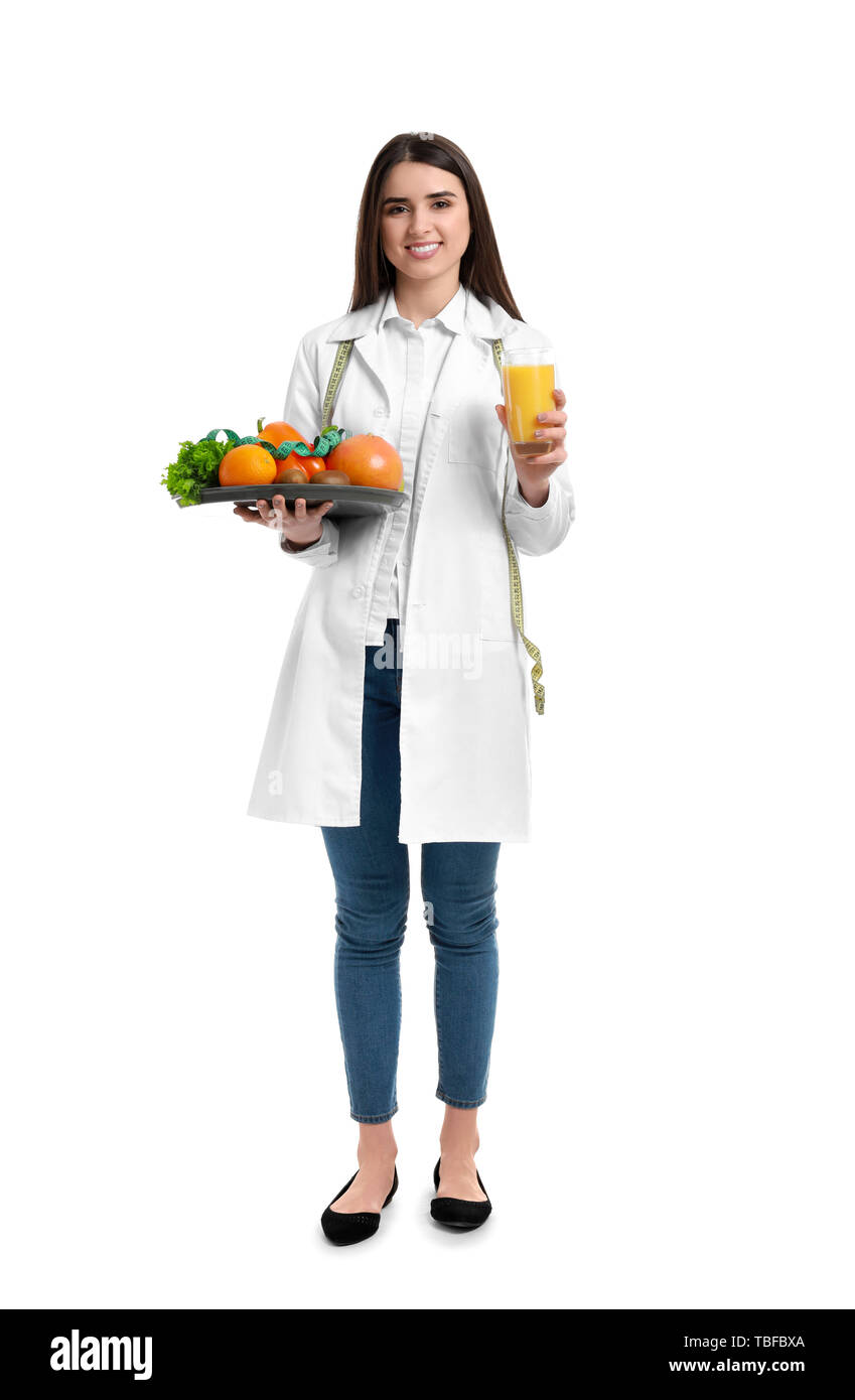 Portrait of female nutritionist with healthy products on white ...