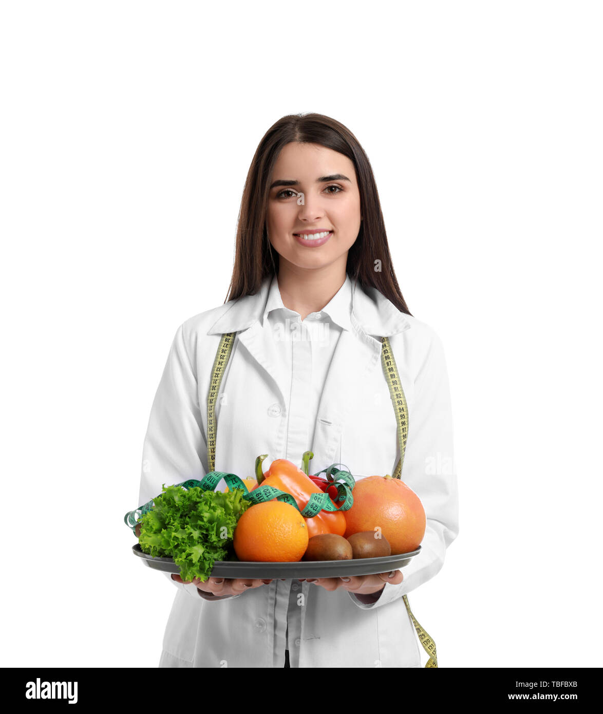 Portrait of female nutritionist with healthy products on white ...