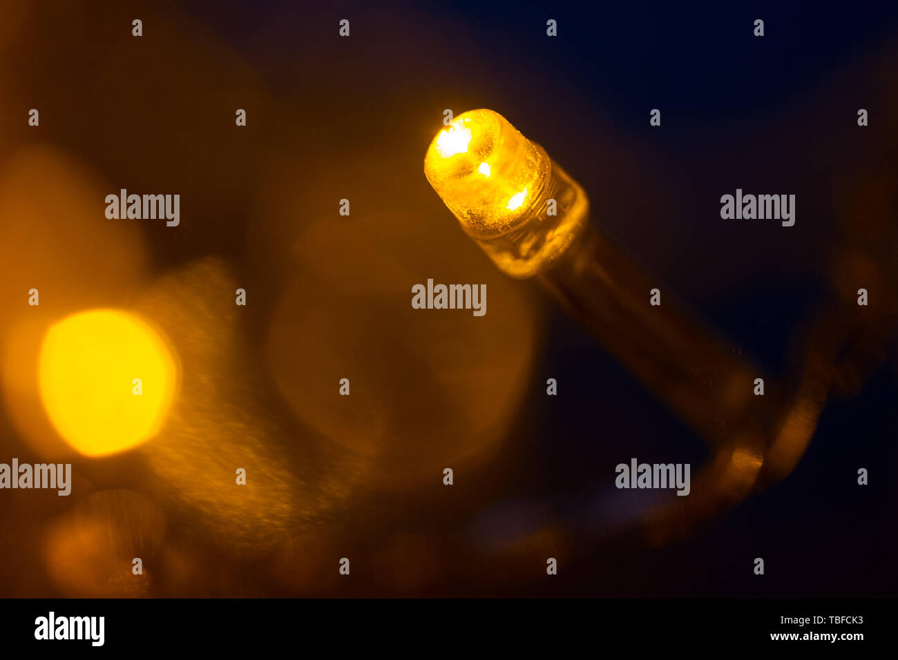 Christmas lights glowing. yellow color close up Stock Photo - Alamy