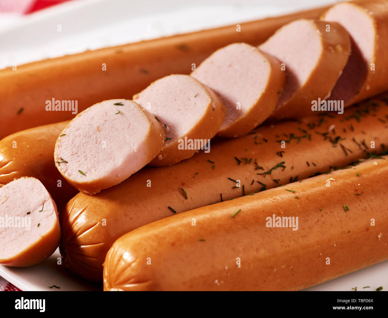 Sausages cut sliced into pieces with spice close up big portion Stock ...