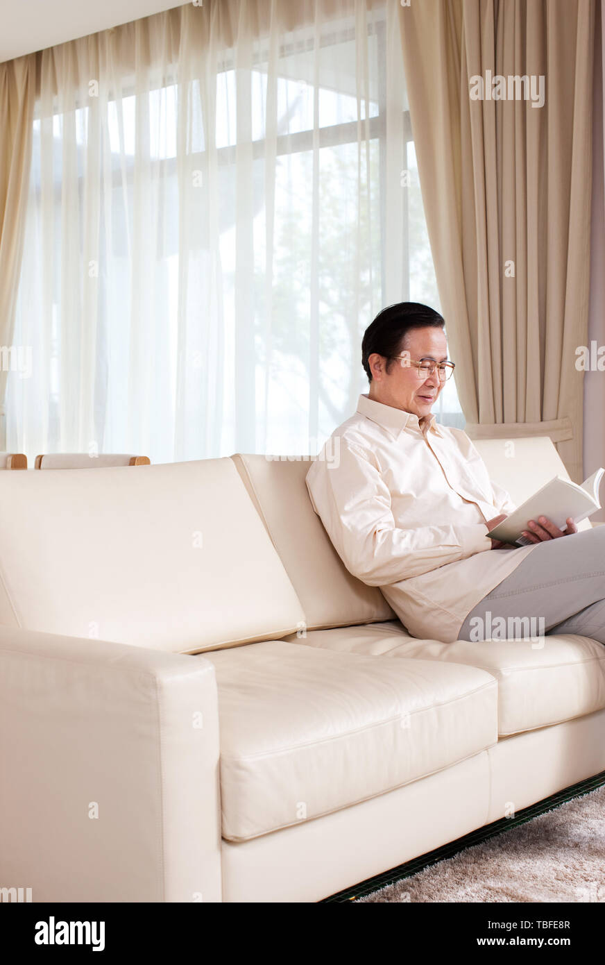 The elderly read books and enjoy their old age Stock Photo - Alamy